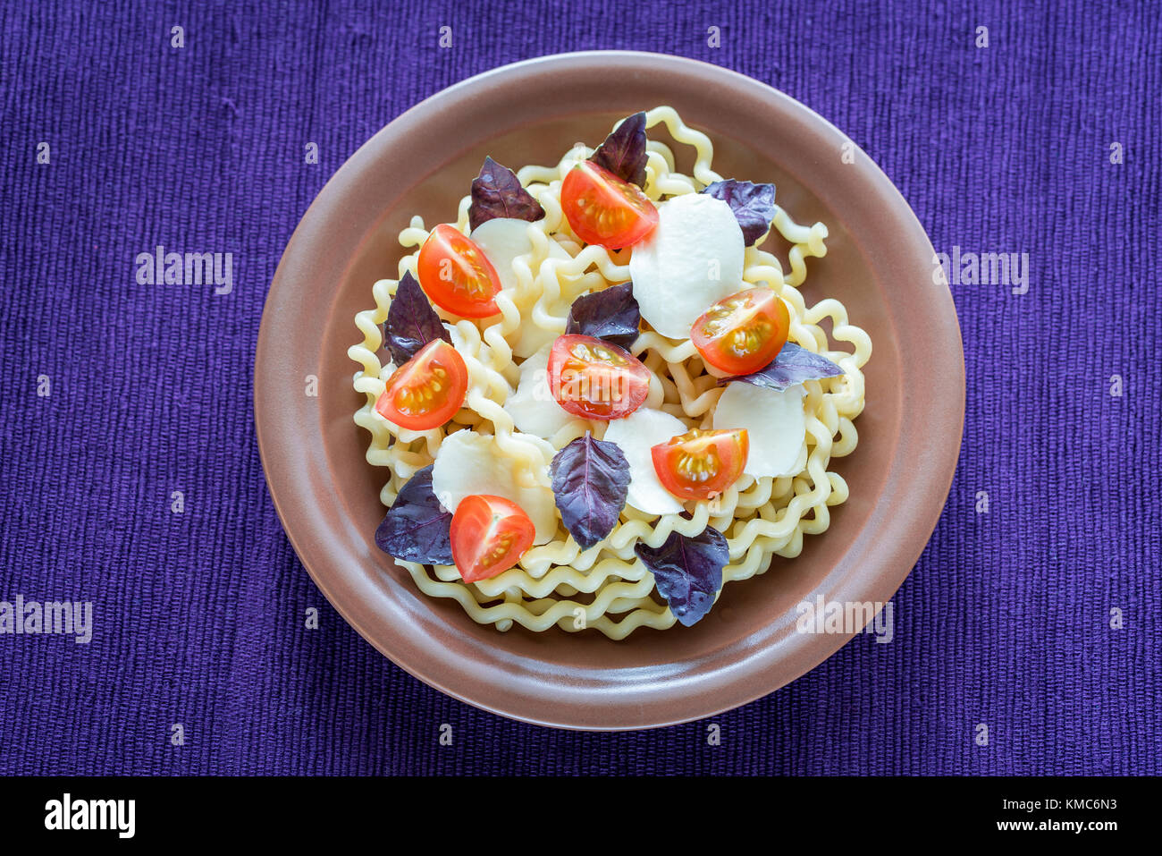 Fusilli lunghi with cheese and cherry tomatoes Stock Photo - Alamy