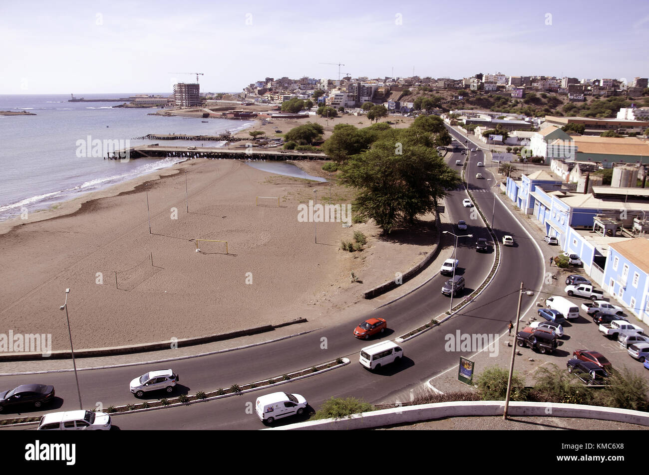 A football pitch, a sandy stadium, created on a broad beach beside a ...