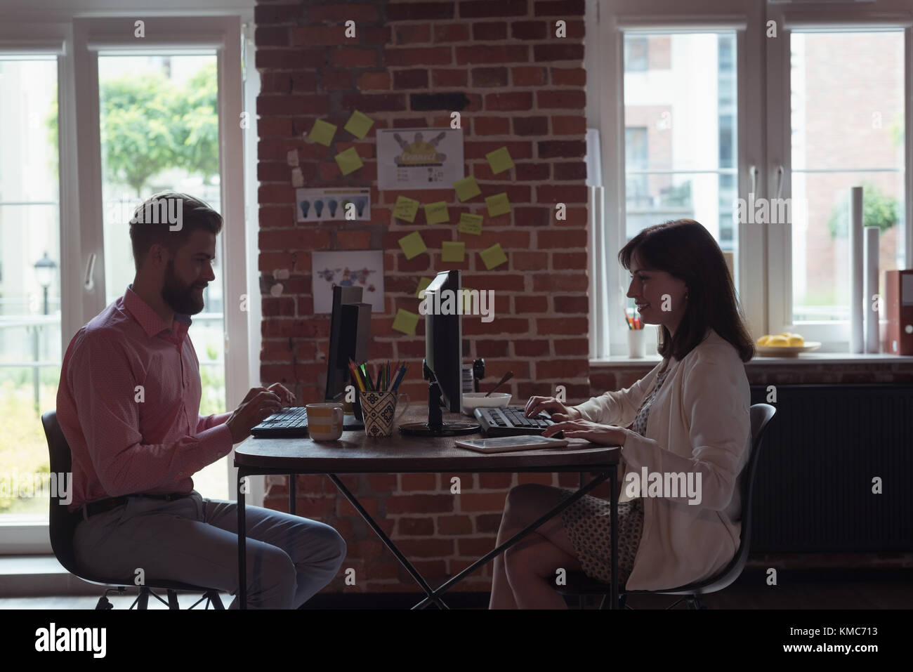 Man working at computer brick hi-res stock photography and images - Alamy