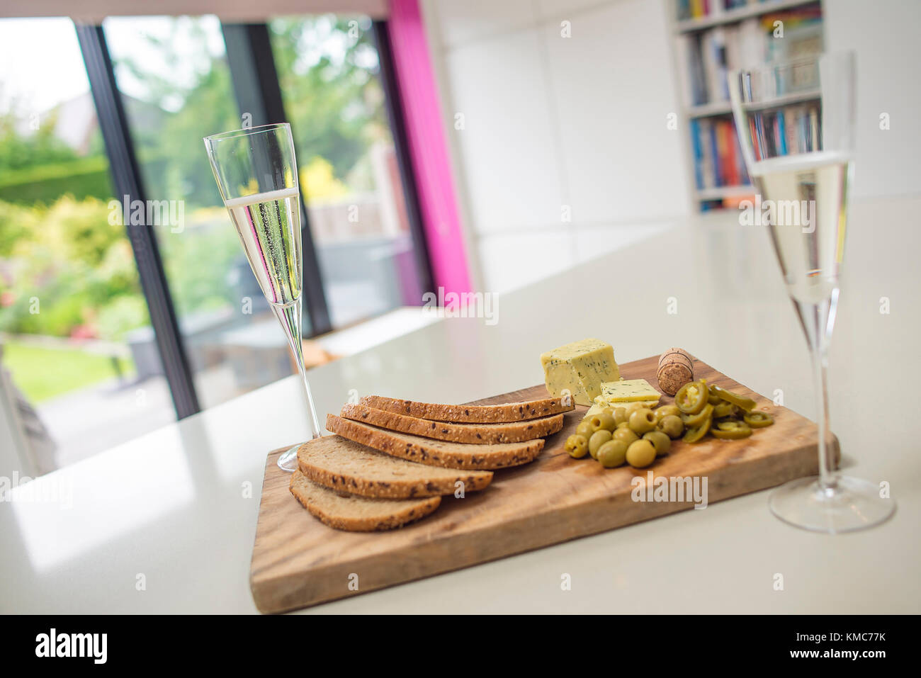 Champagne Flutes and Food on Kitchen Counter Stock Photo - Alamy