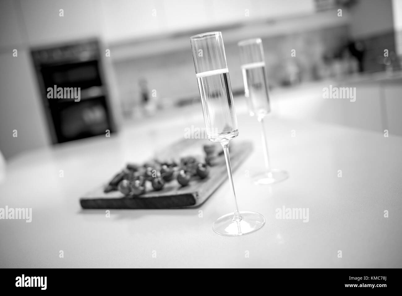 Champagne Flutes and Food on Kitchen Counter Stock Photo - Alamy