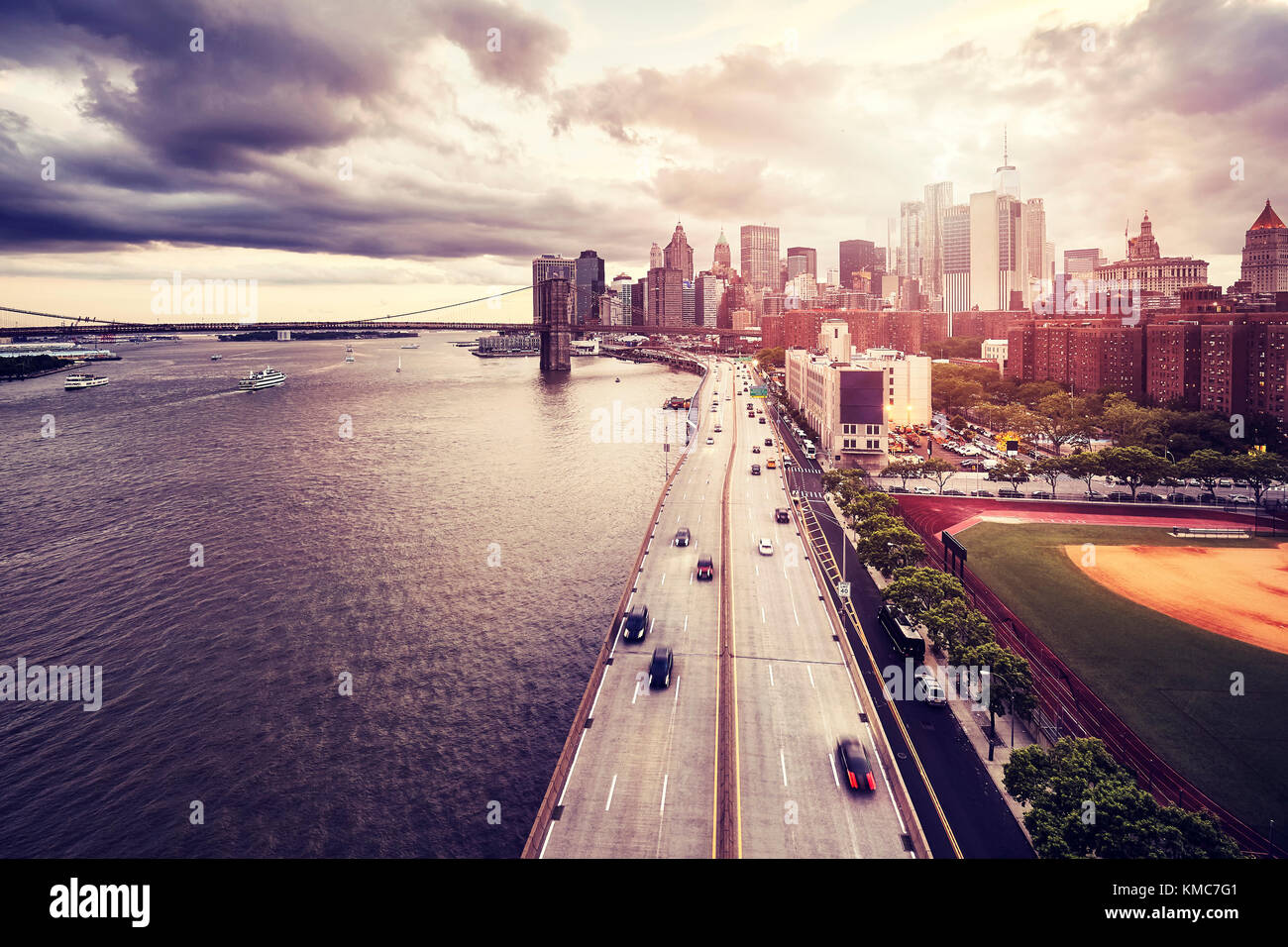 Dramatic sunset over Manhattan, color toned picture, New York, USA ...