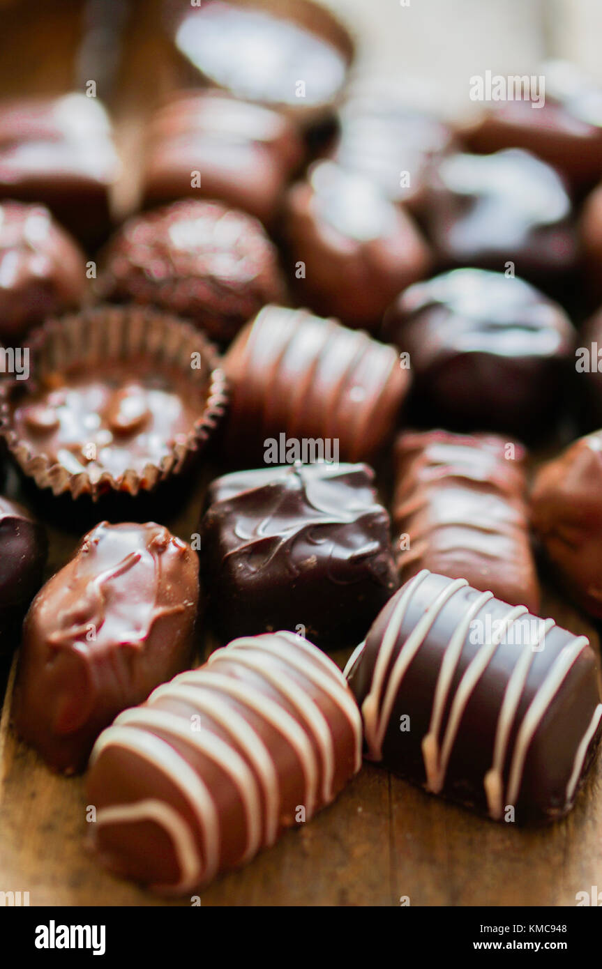 Assorted Chocolate Pralines On Brown Background Stock Photo - Alamy
