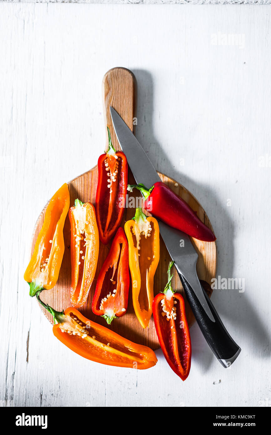 Colorful peppers on rustic background Stock Photo - Alamy
