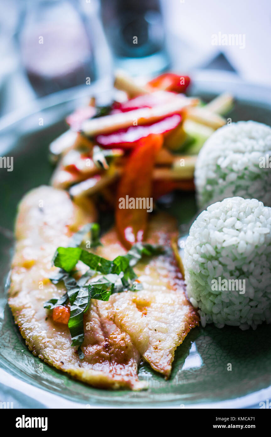 Fish With Rice And Vegetables Stock Photo - Alamy