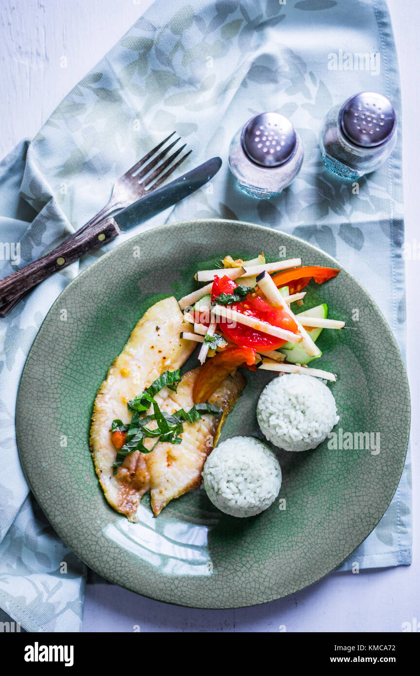 Fish With Rice And Vegetables Stock Photo - Alamy
