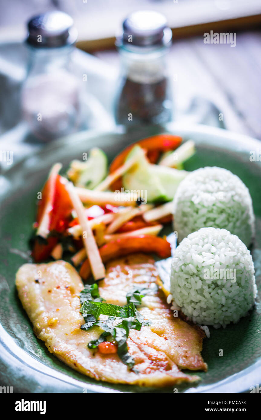 Fish With Rice And Vegetables Stock Photo - Alamy