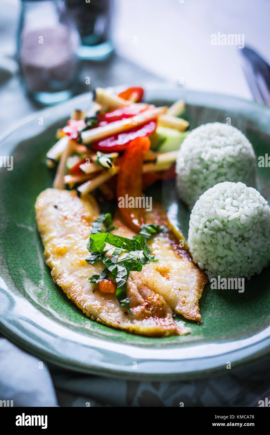 Fish With Rice And Vegetables Stock Photo - Alamy