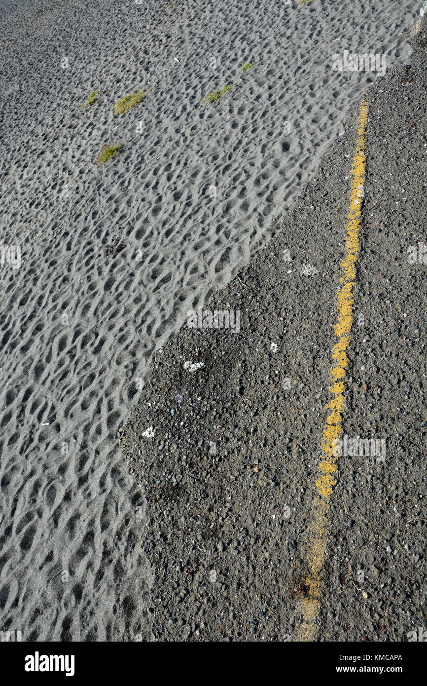 Broken road with sand background Stock Photo - Alamy