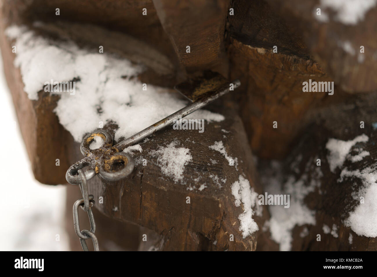 Iron key on chain Stock Photo - Alamy