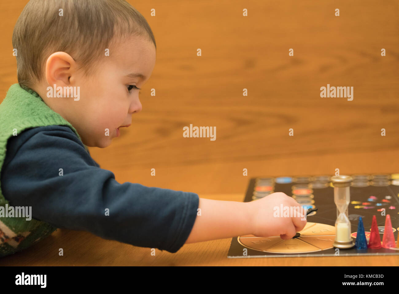 baby boy playing a board game Stock Photo - Alamy