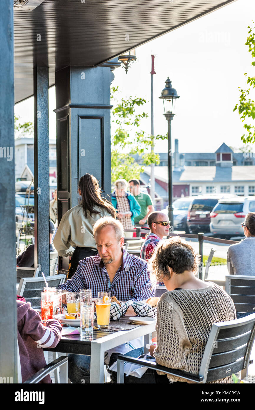 Bar Harbor, USA - June 8, 2017: People eating outside restaurant by ...