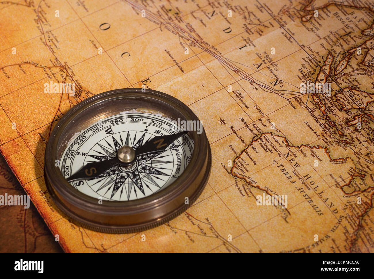 Antique brass compass on map hi-res stock photography and images - Alamy
