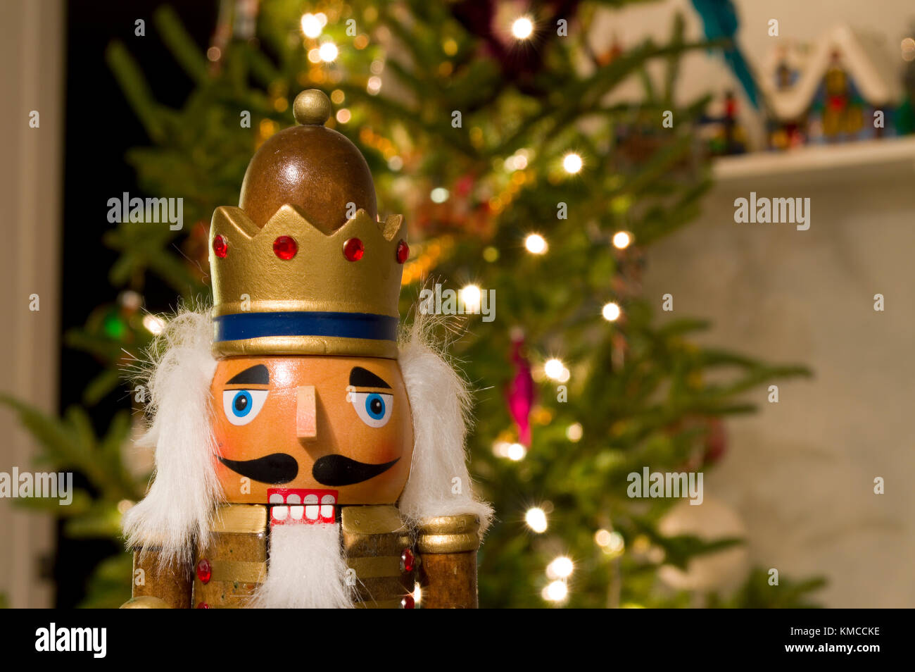 Nutcracker in front of Christmas tree Stock Photo - Alamy
