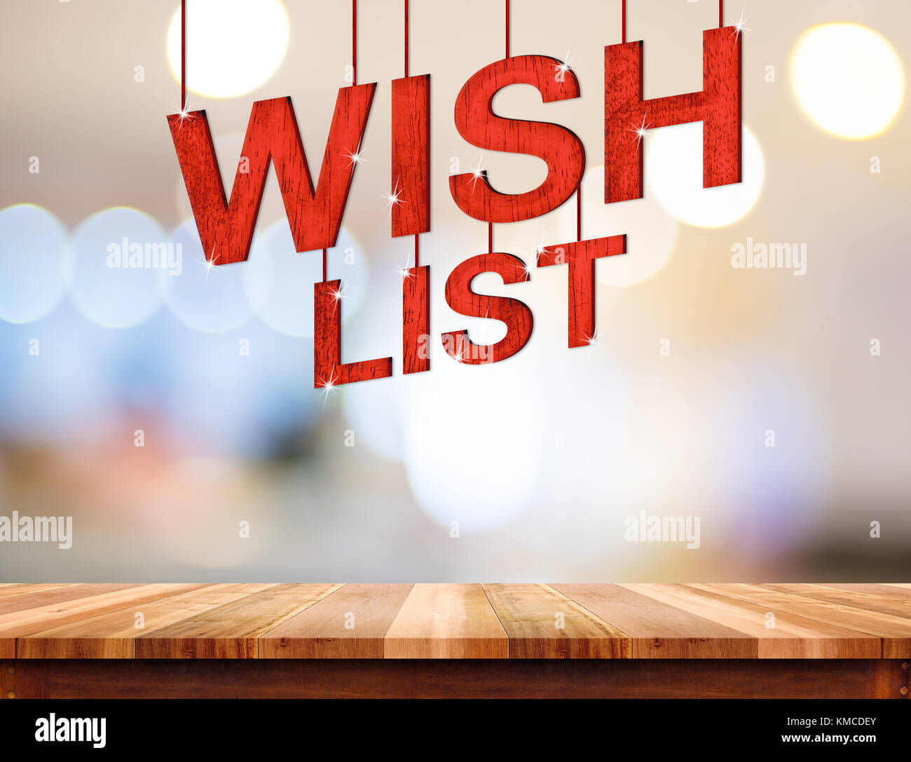 Wish list word hanging over wood table with blurred abstract bokeh ...