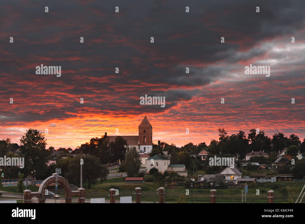 Mir, Belarus. Amazing Sunset Over Landscape Of Village Houses And Saint ...