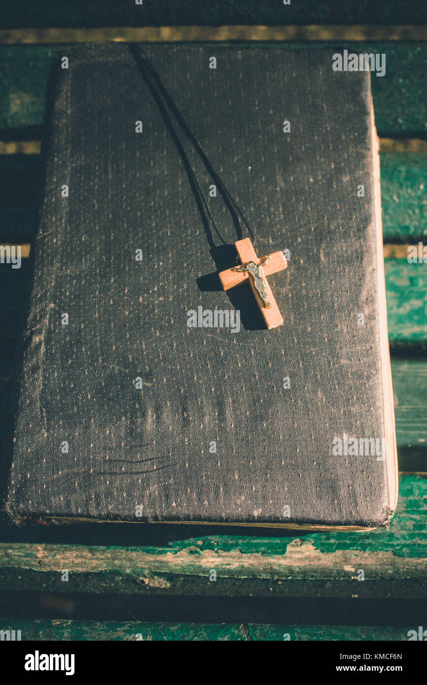 Vintage old holy bible book, grunge textured cover with wooden ...