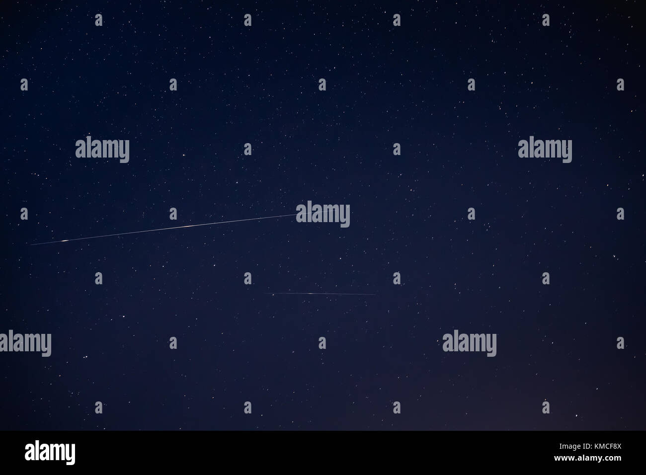 Two Meteoric Tracks In The Blue Night Starry Sky Background. Natural ...