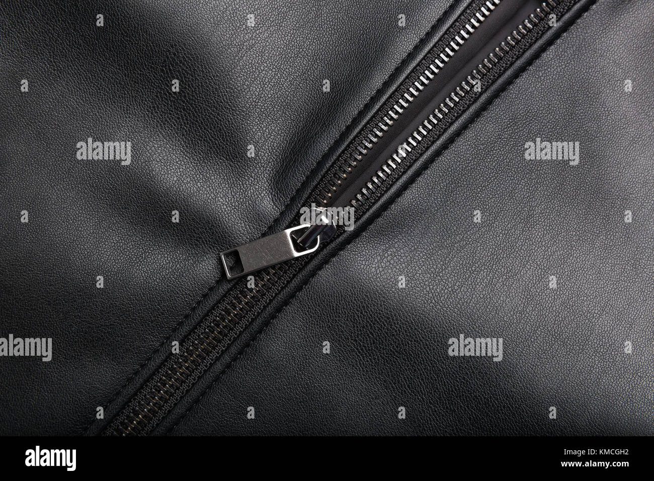 opened zip on black leather surface Stock Photo - Alamy