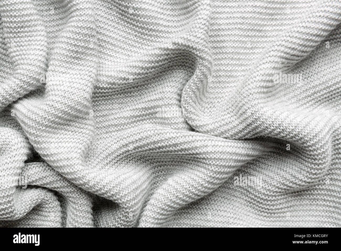 grey woolen knitted fabric as background Stock Photo - Alamy