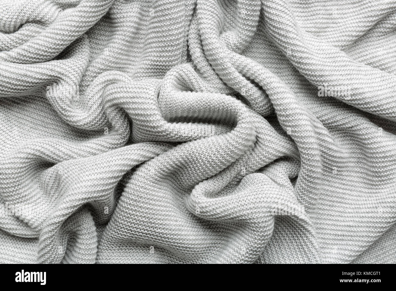 grey woolen knitted fabric as background Stock Photo - Alamy