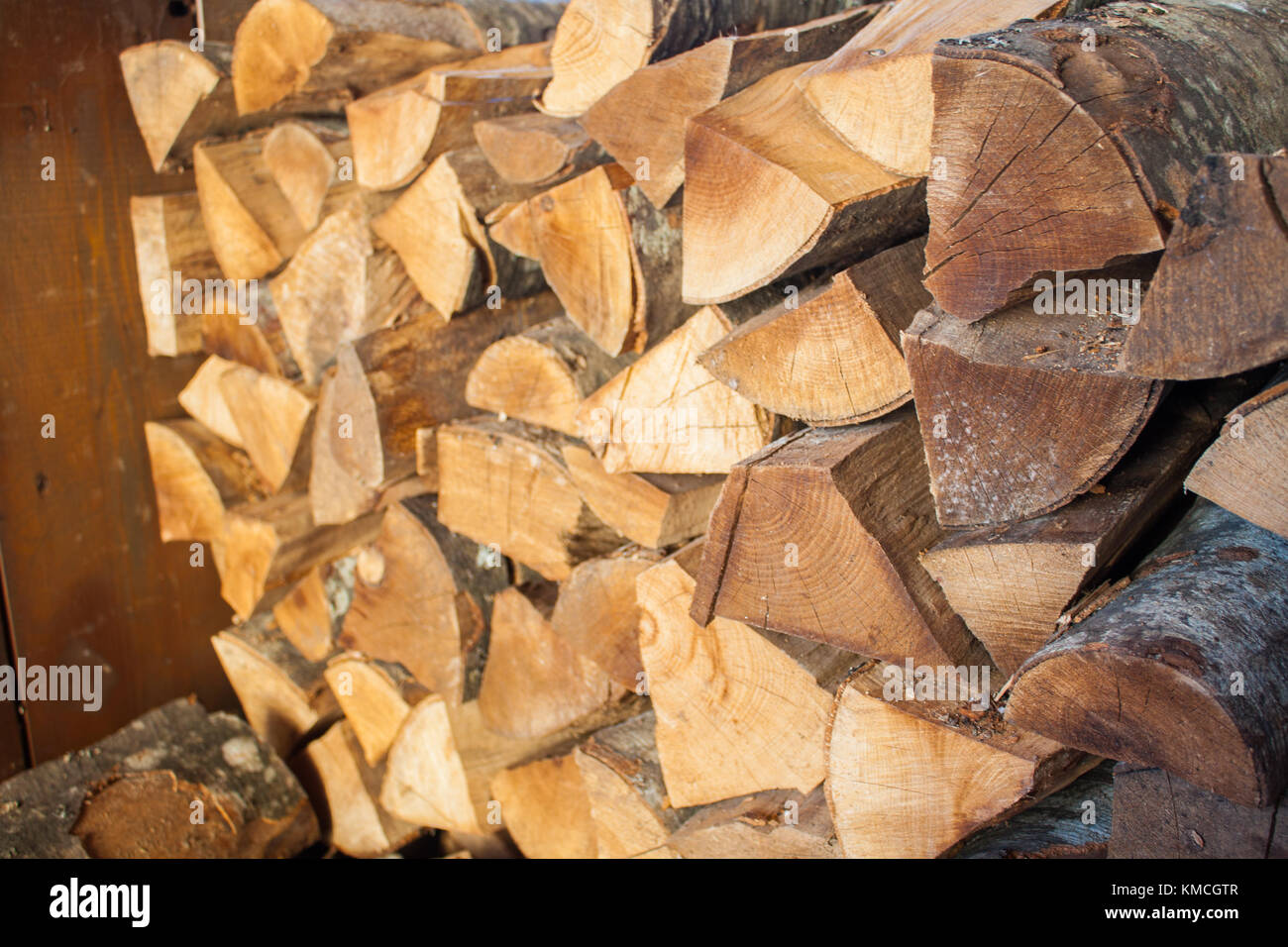 Woodpile of chopped lumber. Pile of wood logs. Stacked firewood timber ...