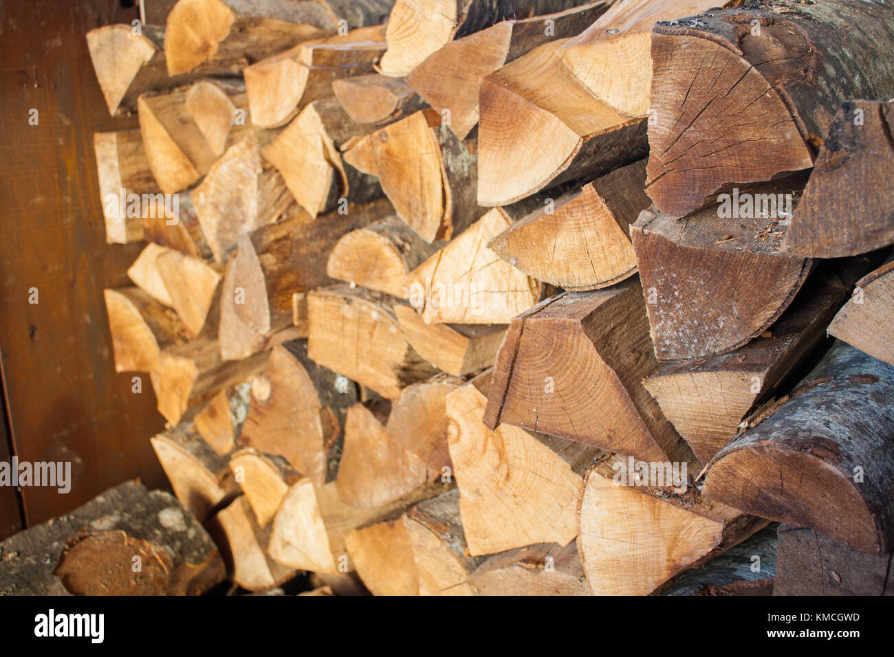 Woodpile of chopped lumber. Pile of wood logs. Stacked firewood timber ...