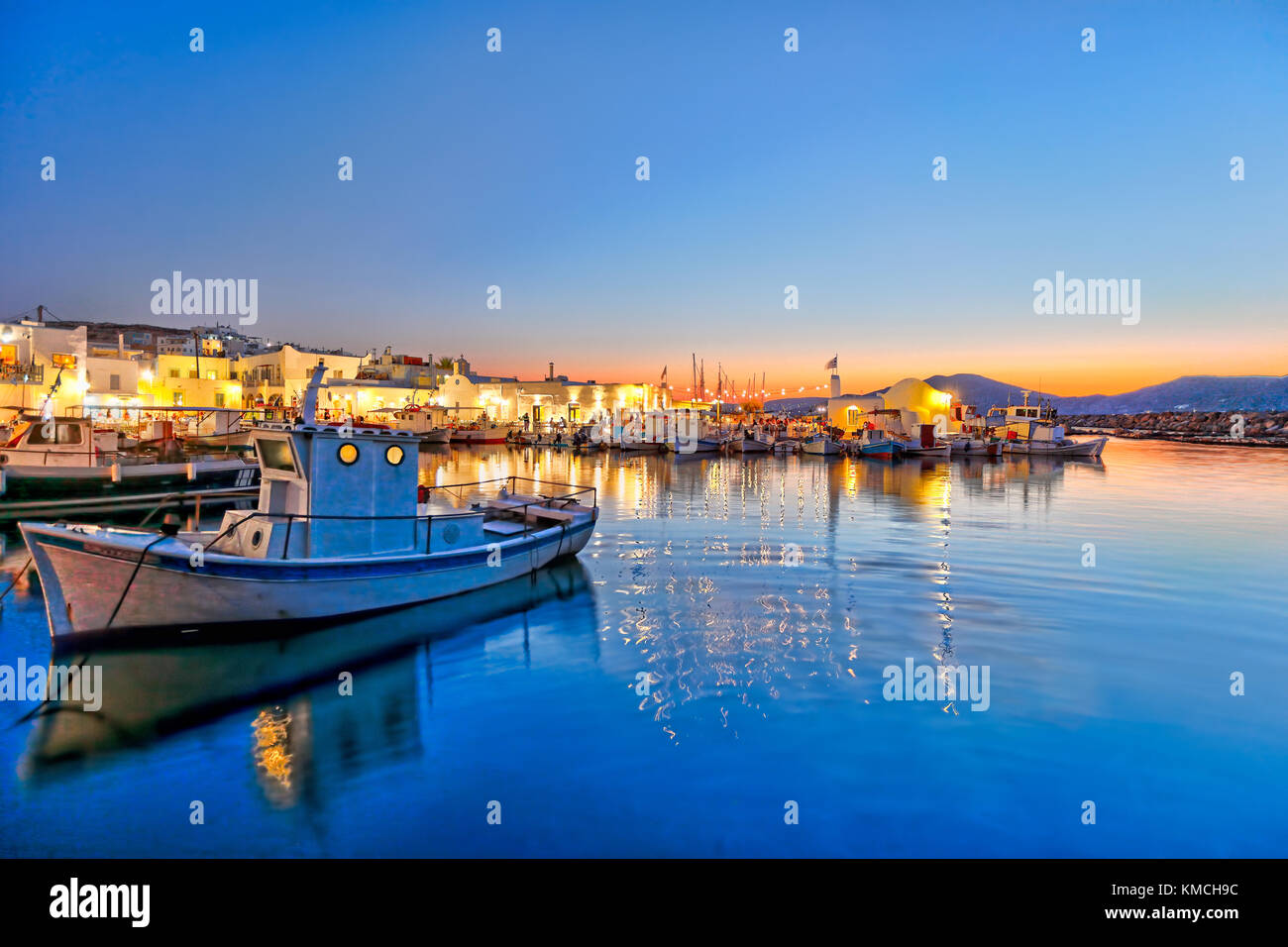 The sunset at the port of Naousa in Paros island, Greece Stock Photo ...