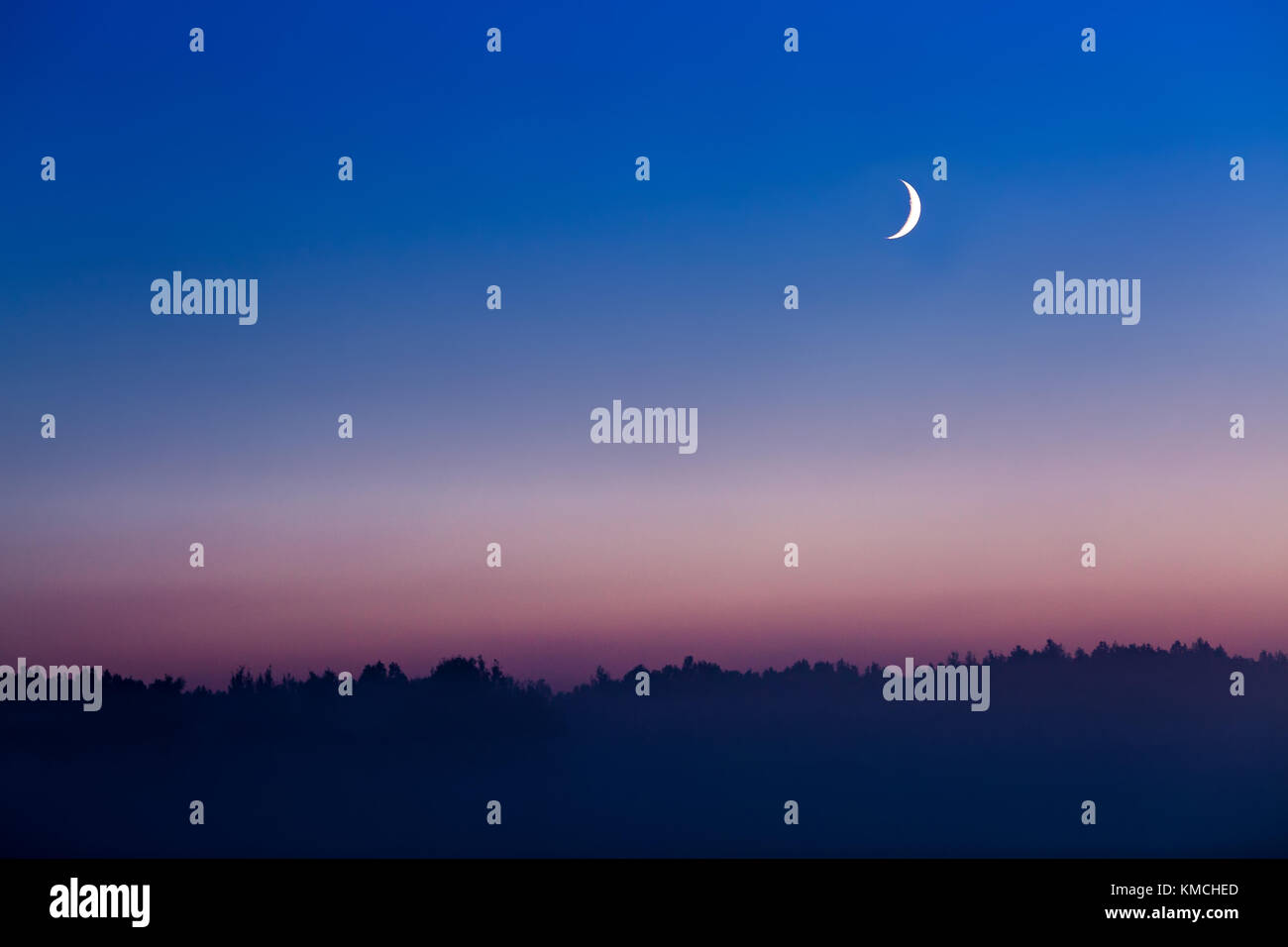 Crescent moon on the dark blue sky Stock Photo - Alamy