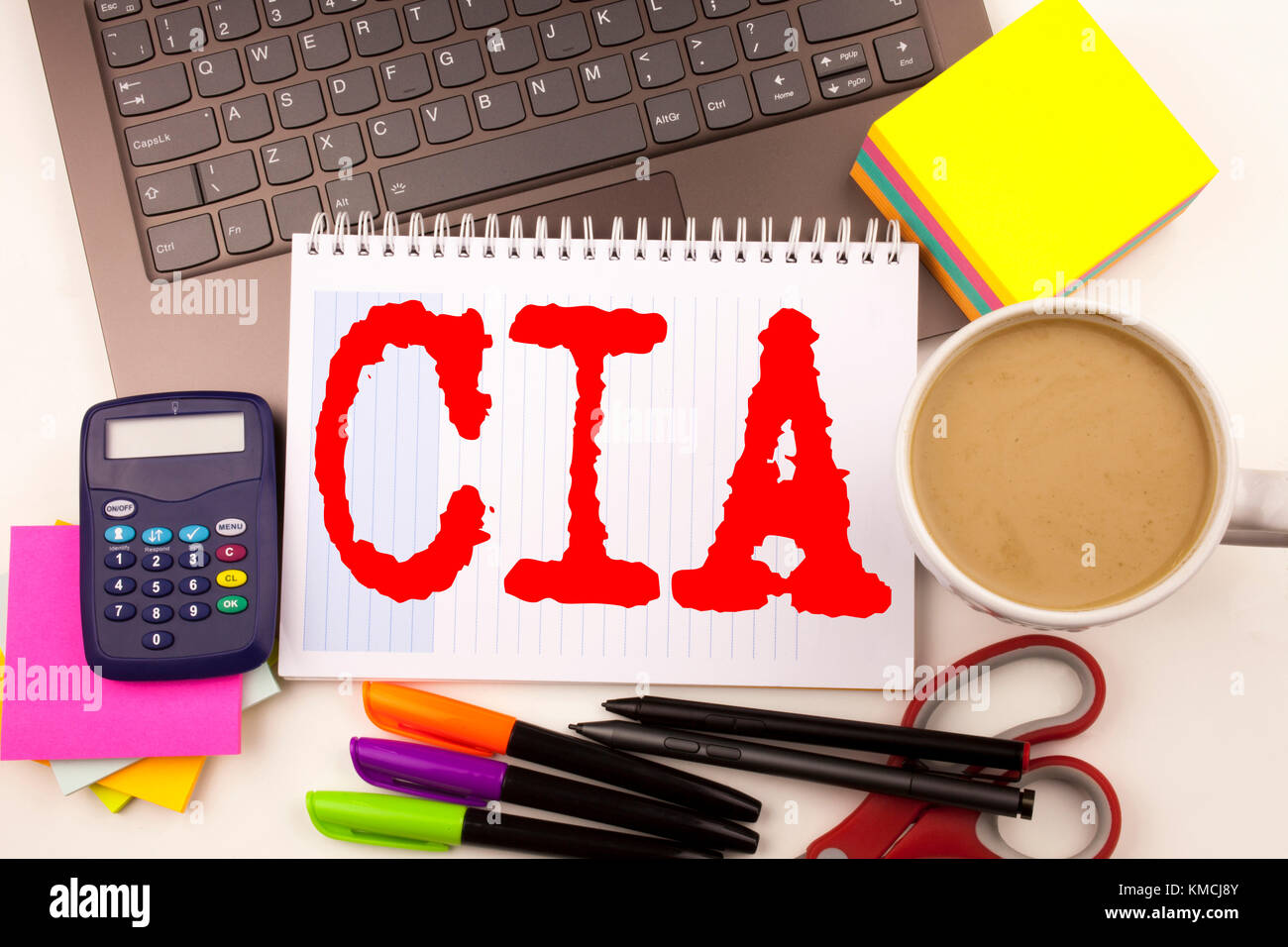 Word writing CIA in the office with laptop, marker, pen, stationery ...