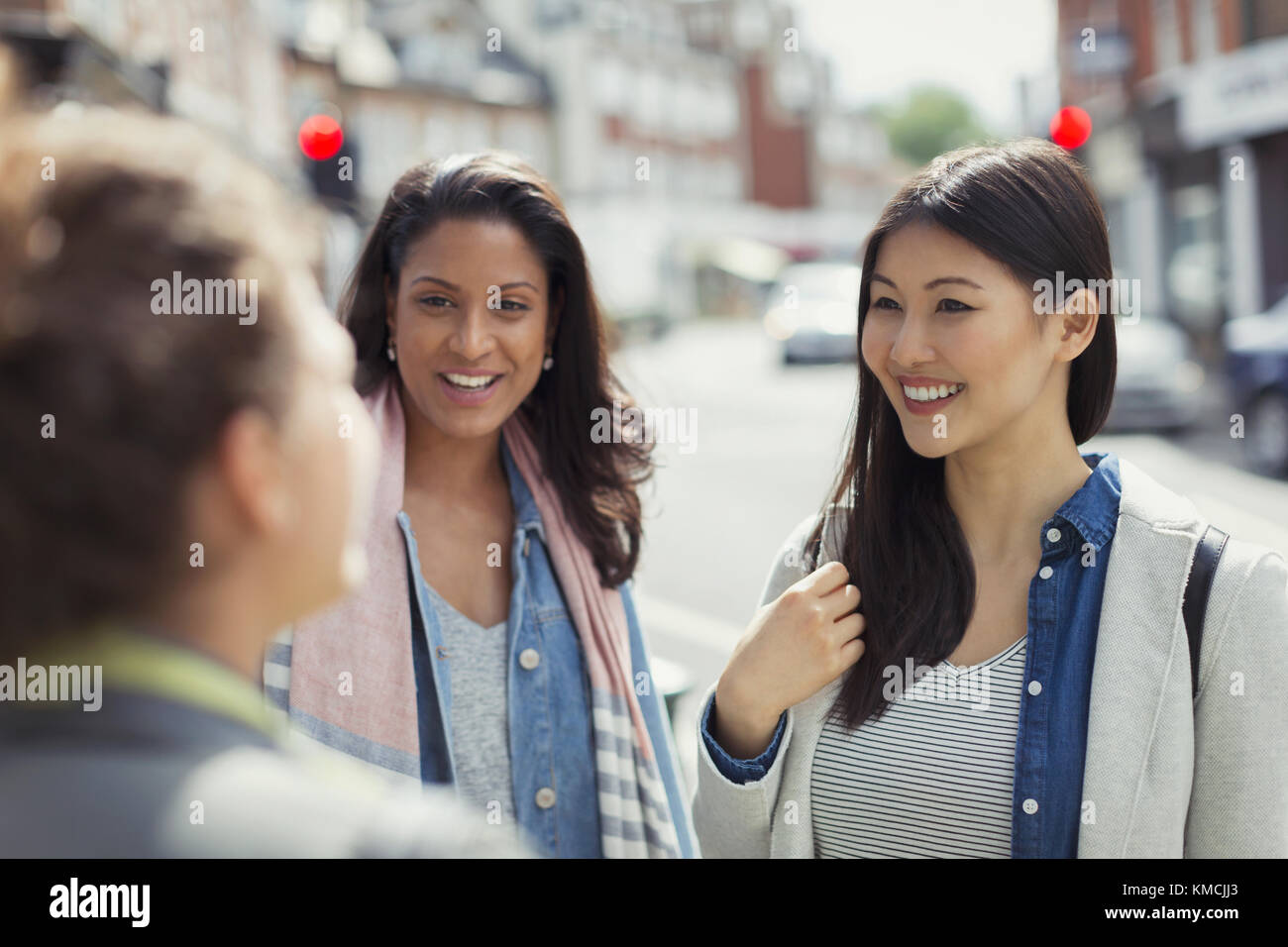 Women smile on street hi-res stock photography and images - Alamy