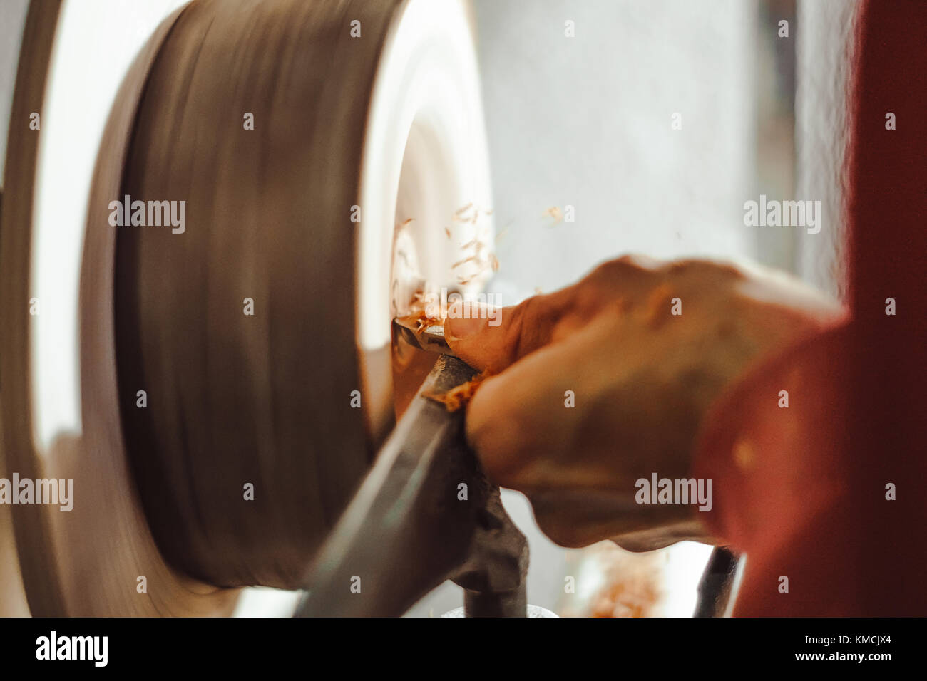 Foot operated spring pole wood lathe.Man operating a foot operated ...