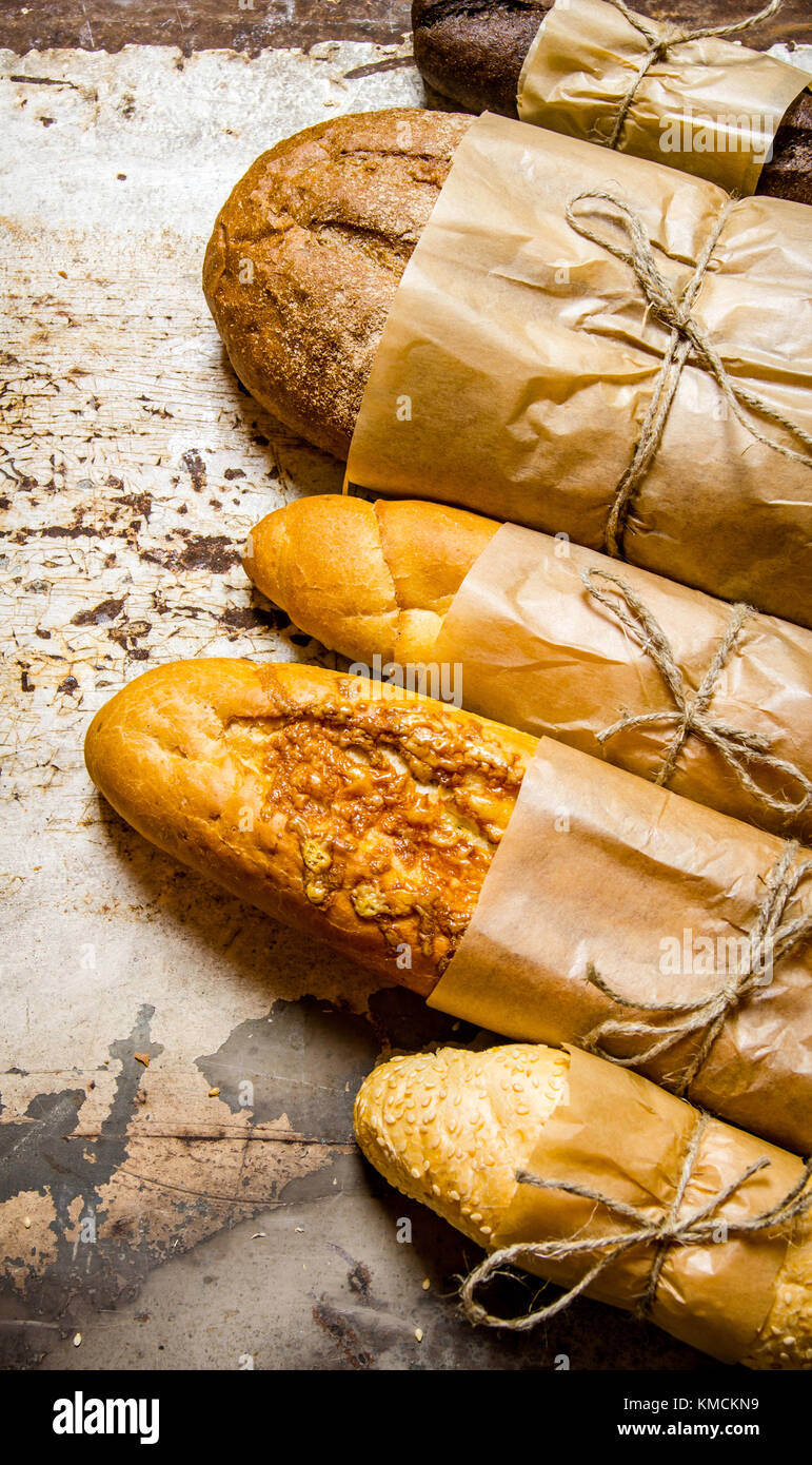 Set fresh bread on a rustic background Stock Photo - Alamy