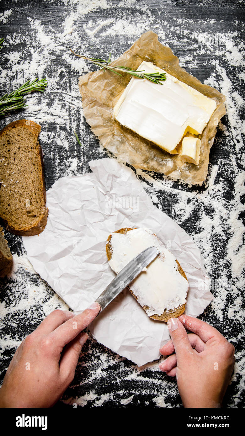 Woman buttering bread hi-res stock photography and images - Alamy