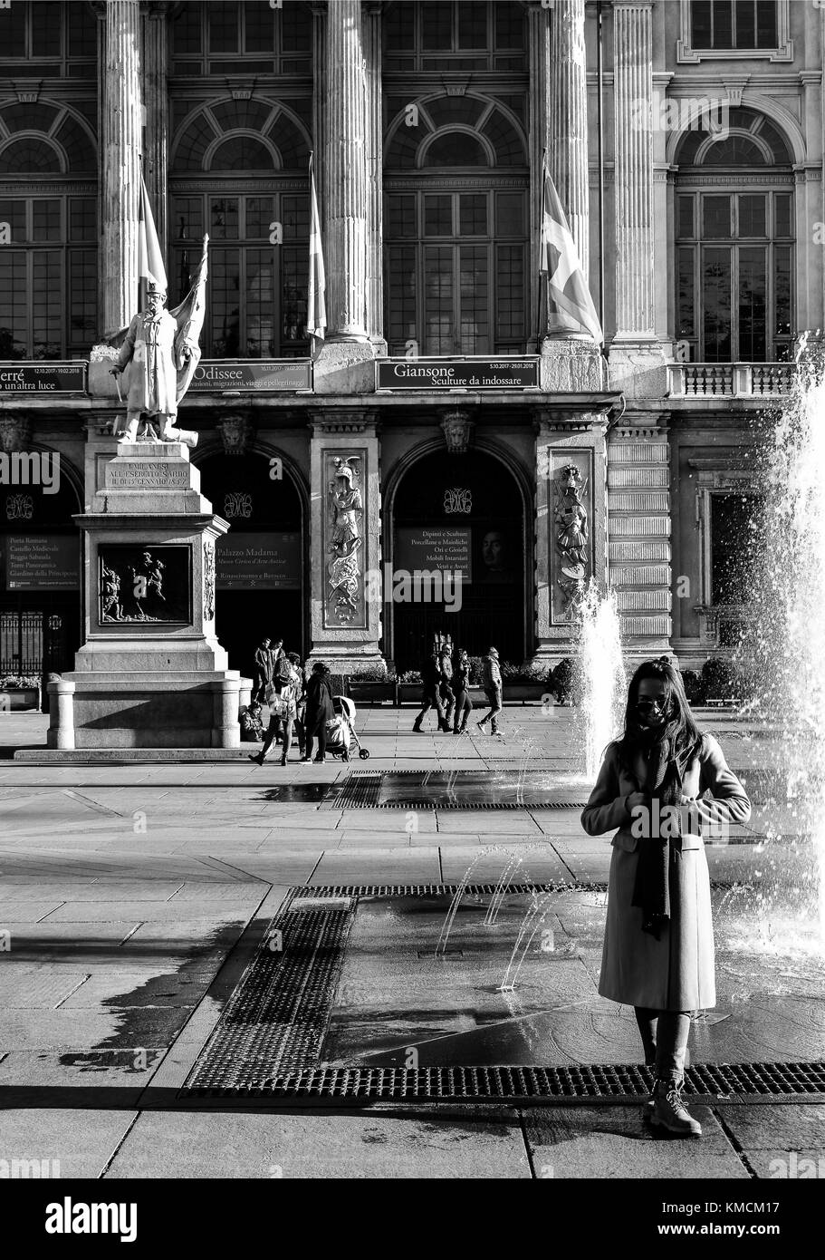 Young woman poses for a photo in Piazza Castello, Turin, Piedmont ...