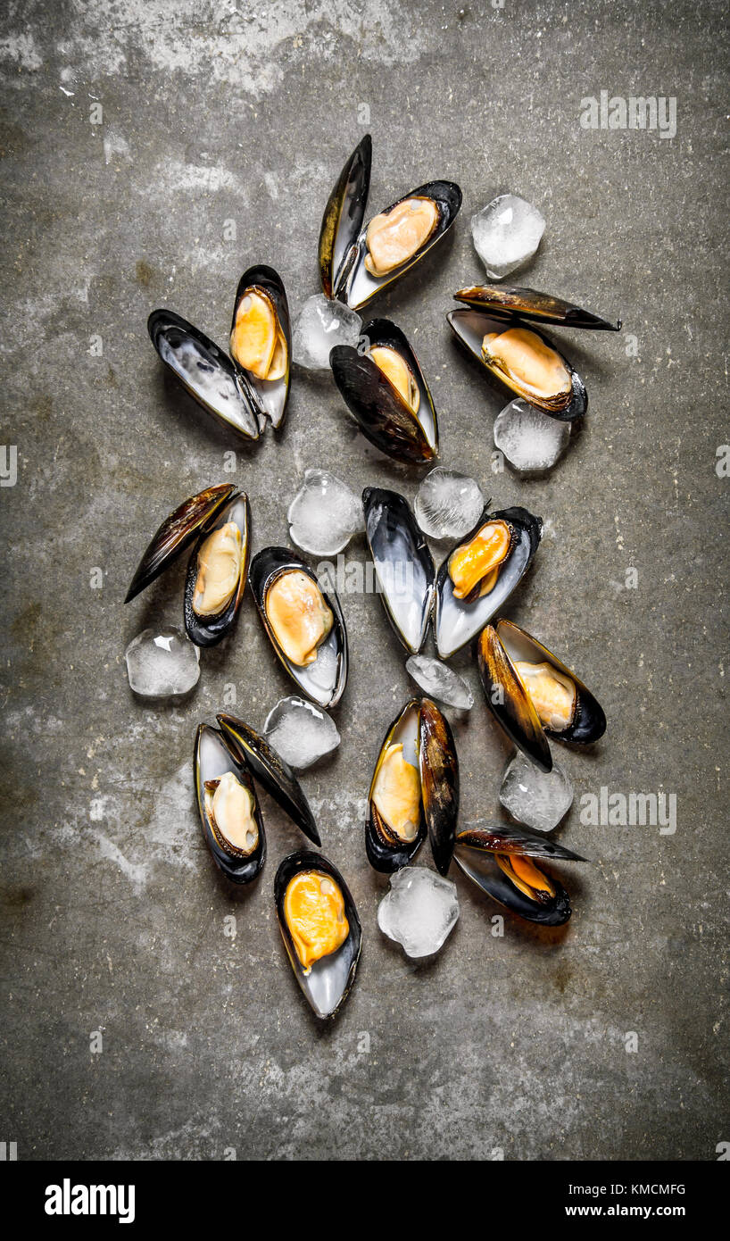 Fresh clams with ice. On the stone table. Top view Stock Photo - Alamy