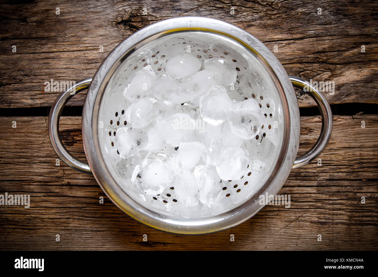 Metal ice bucket for cocktails on a wooden table . Top view Stock Photo ...