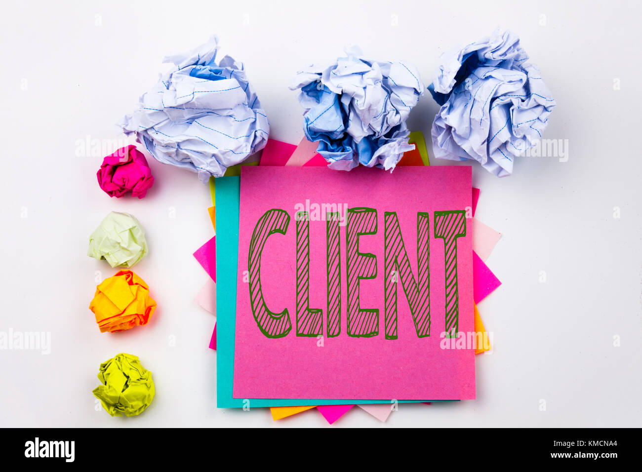 Writing text showing Client written on sticky note in office with screw ...