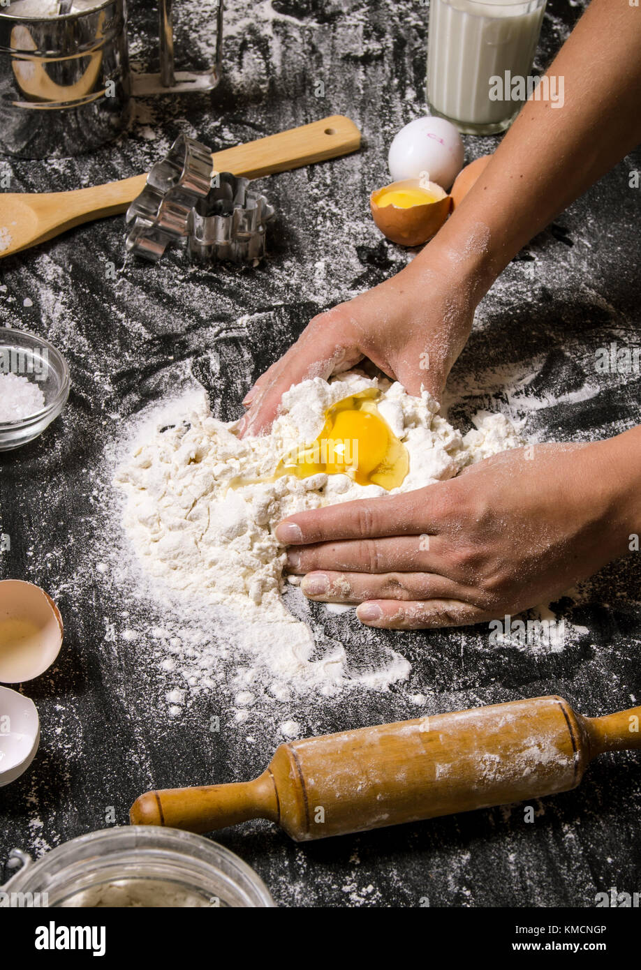 Preparation of the dough . Preparation of the dough the women's hands ...