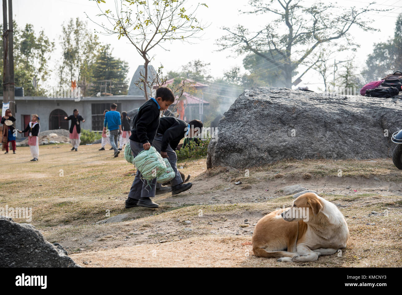 Young kids carrying plastic block as volunteer activity Stock Photo - Alamy