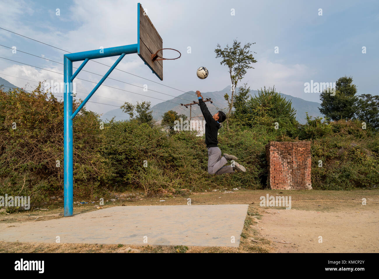 Indian boy playing basketball hi-res stock photography and images - Alamy