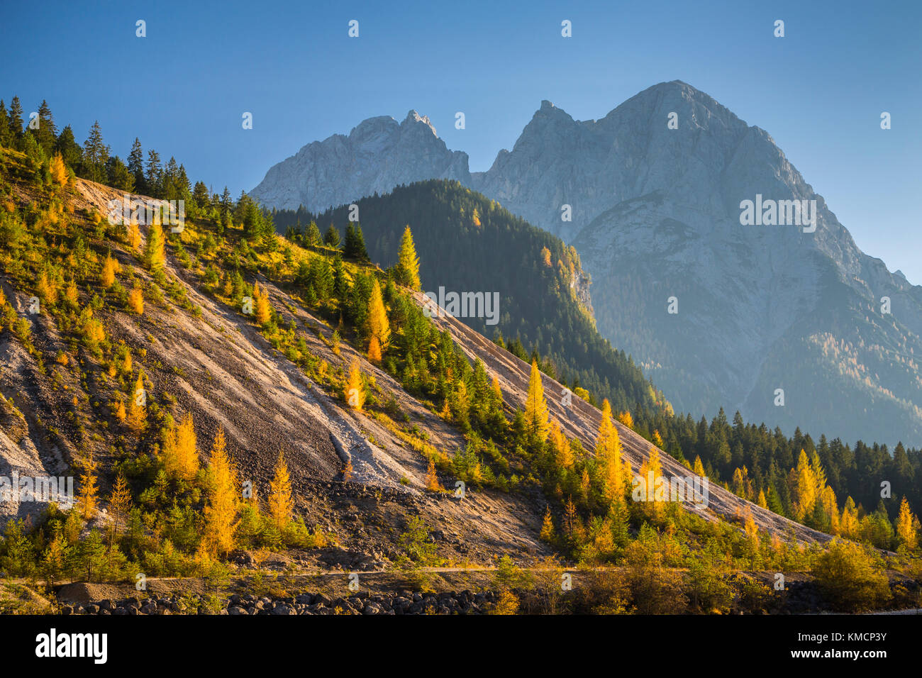 The Dolomite mountain range with fall foliage color near Auronzo di ...