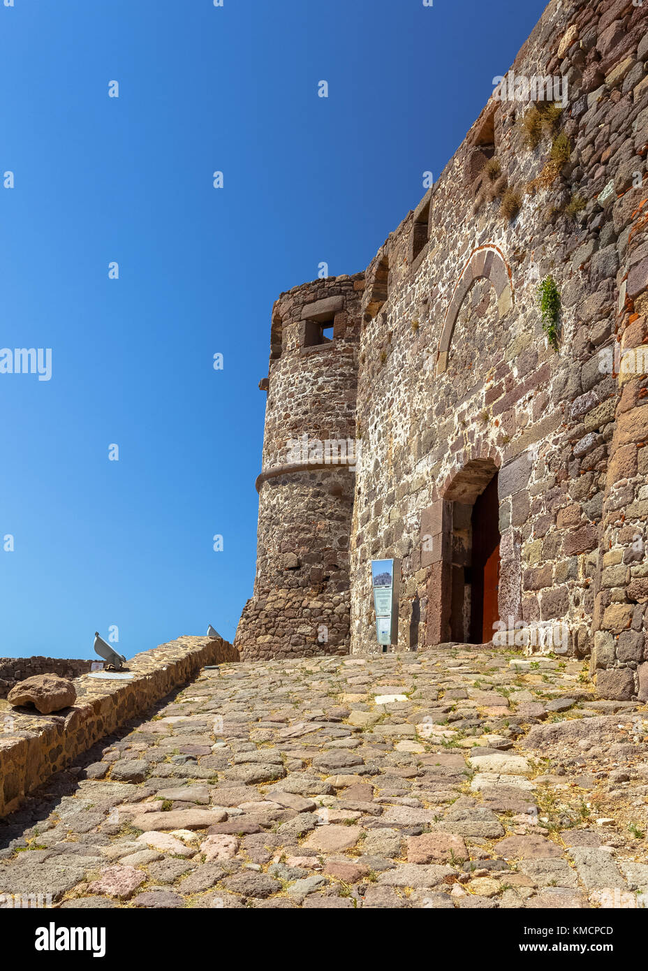 The walls of Molyvos castle against a clear sky on the north part of ...