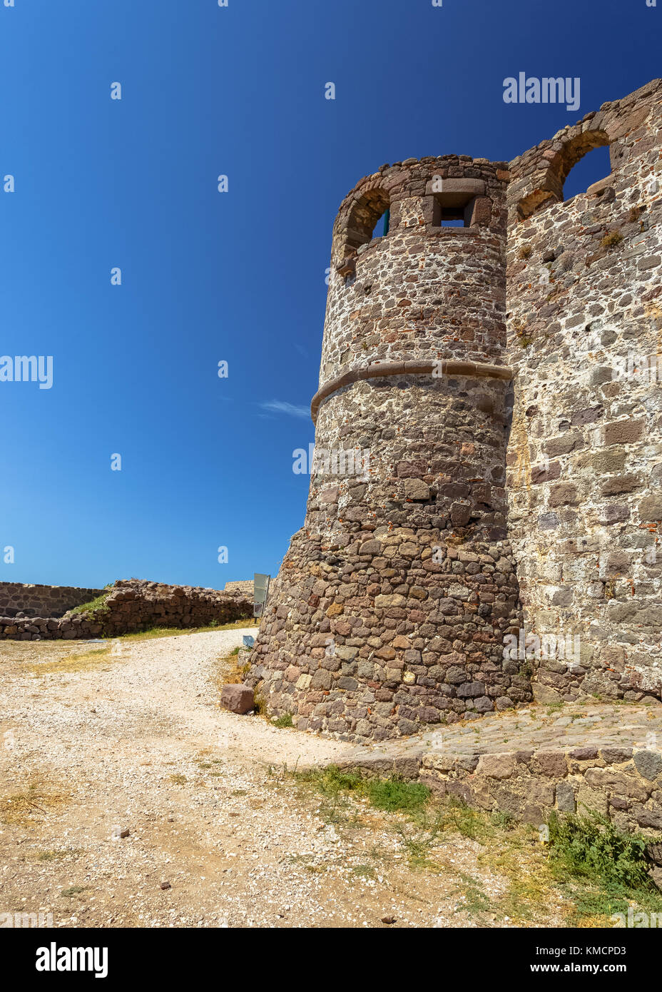 The walls of Molyvos castle against a clear sky on the north part of ...