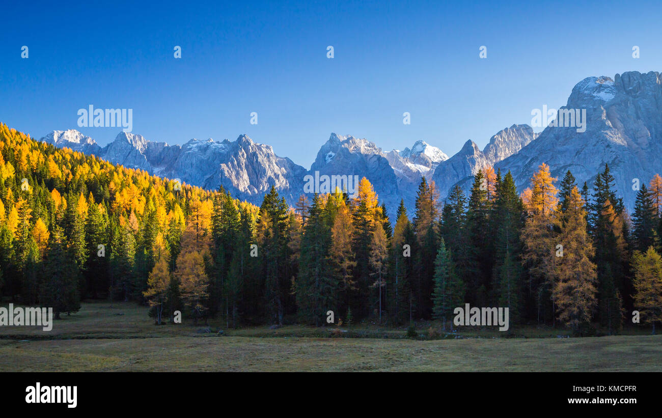 The Dolomite mountain range with fall foliage color near Auronzo di ...