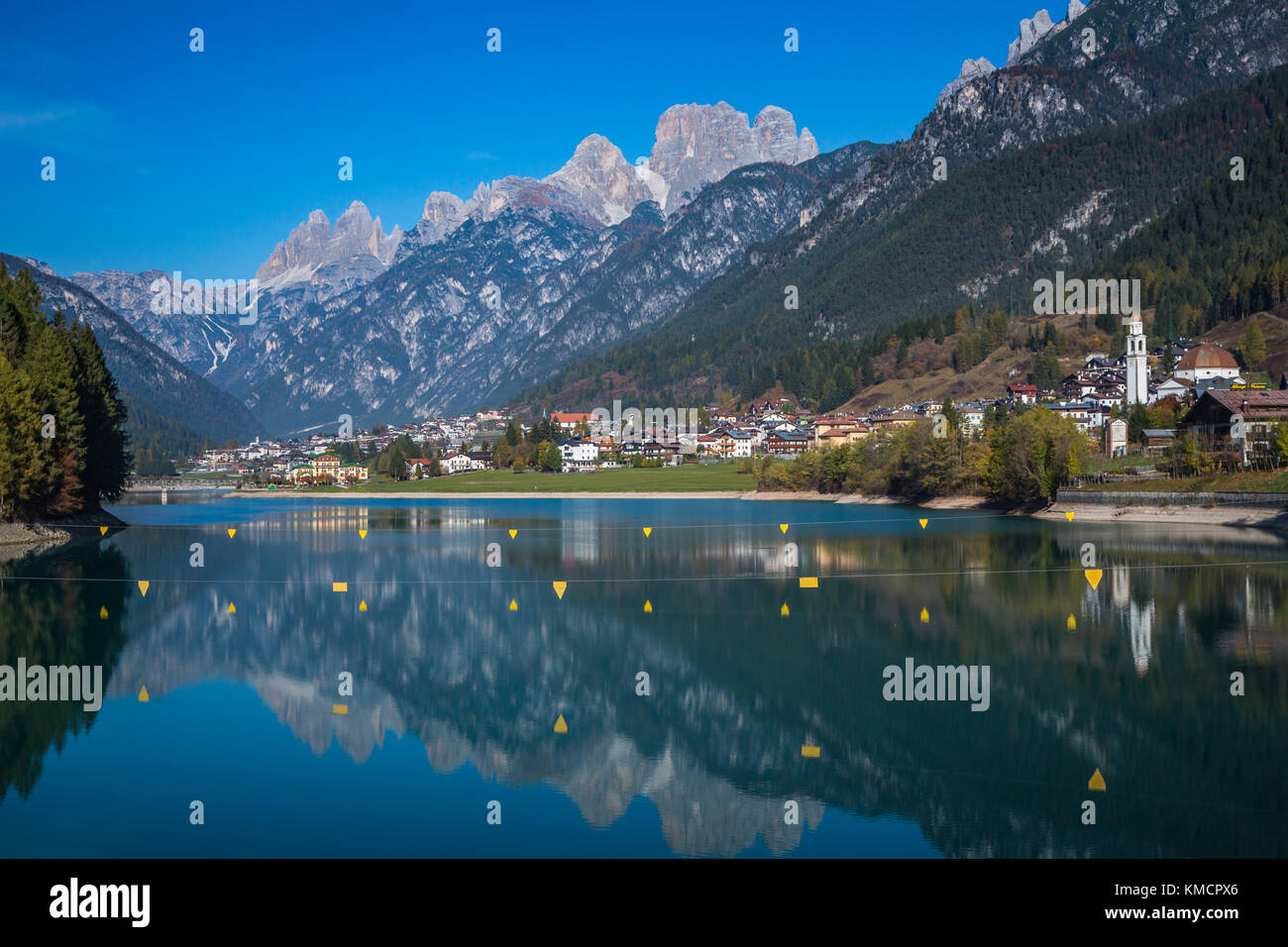The Italian town of Auronzo di Cadore with reflections in Santa ...