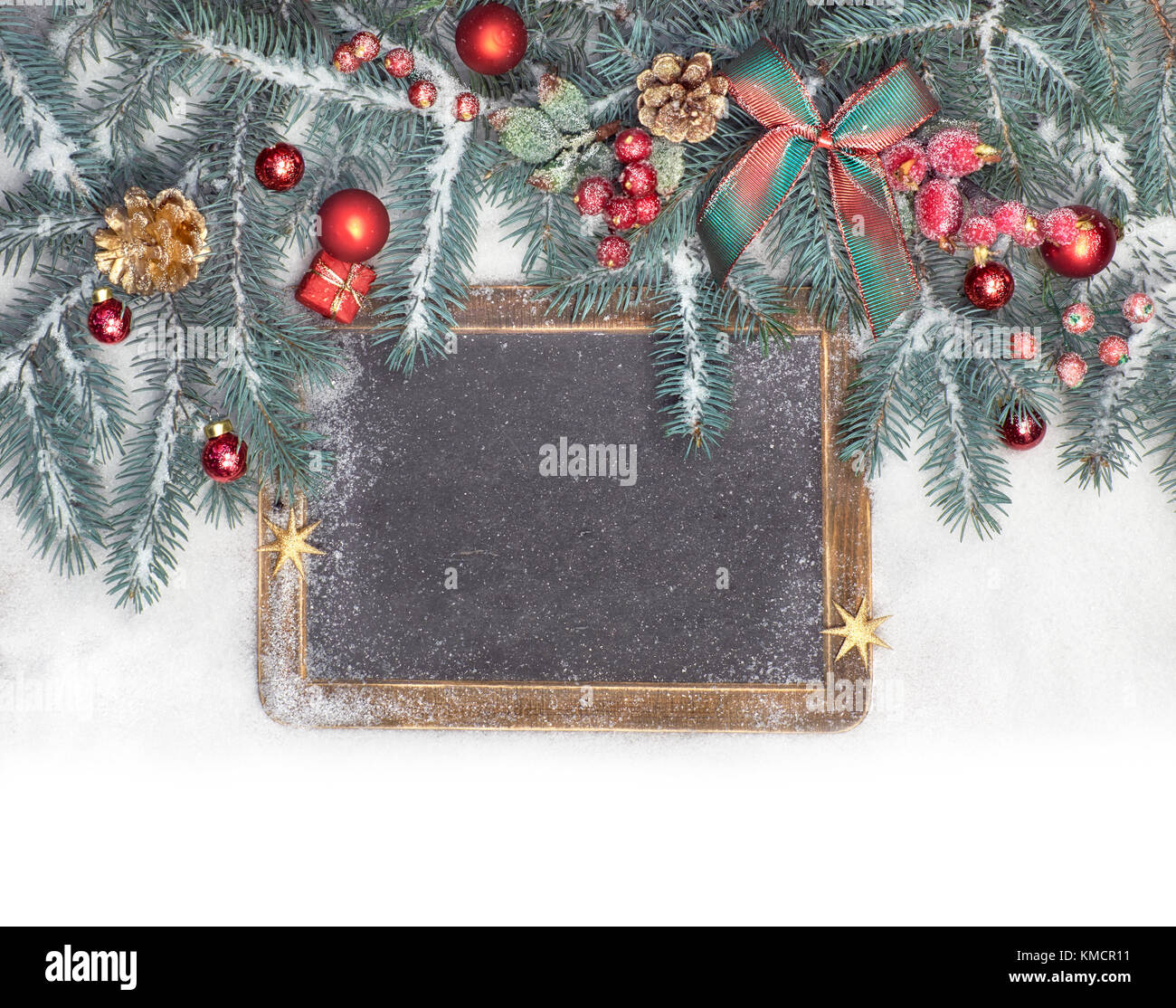 Empty blackboard with Christmas decorations on snow. Top view, text ...
