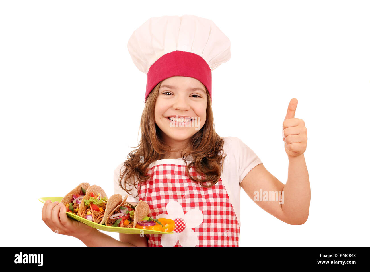 happy little girl cook with tacos and thumb up Stock Photo - Alamy