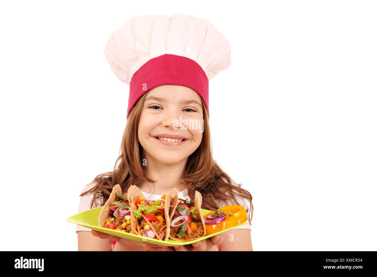Happy little girl cook with tacos fast food on plate Stock Photo - Alamy