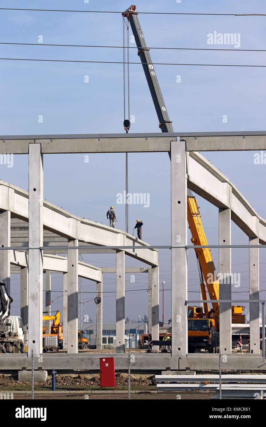 new factory construction site with workers Stock Photo - Alamy